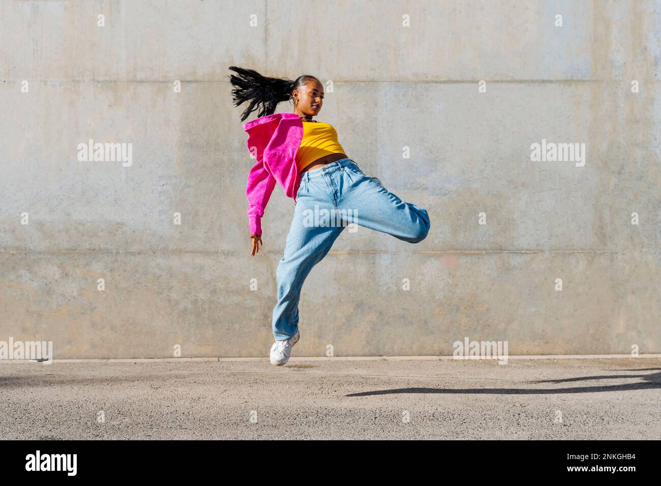 Young dancer hip hop dancing in front of wall Stock Photo - Alamy
