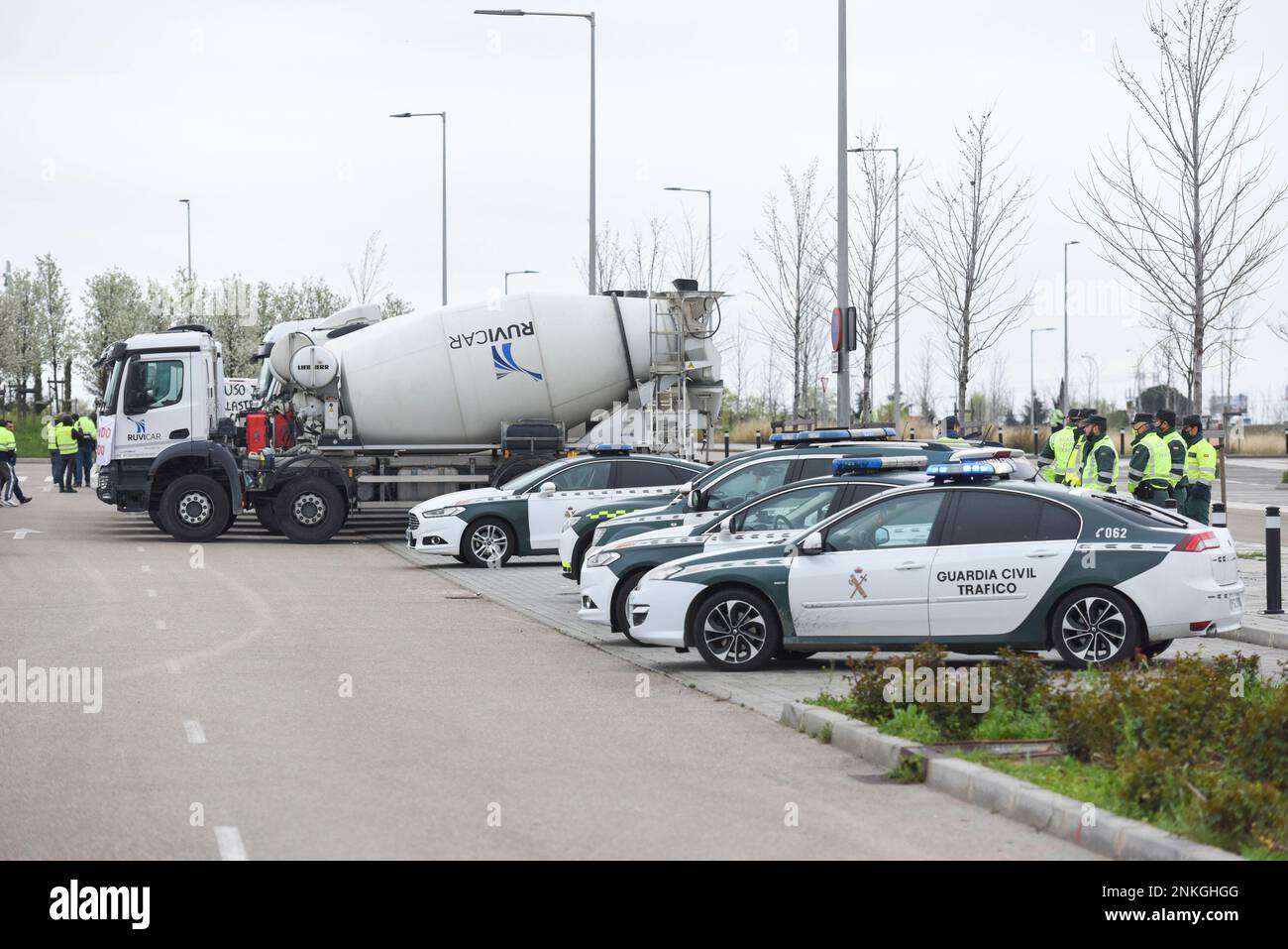 Several vehicles of the Guardia Civil and a concrete vat parked in the ...