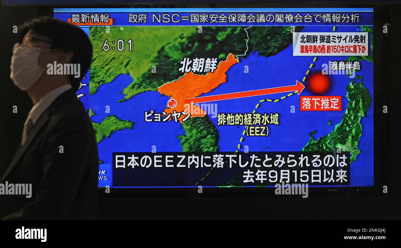 TV on the street shows the news of a missiles launched from North Korea in Chiyoda Ward, Tokyo ...