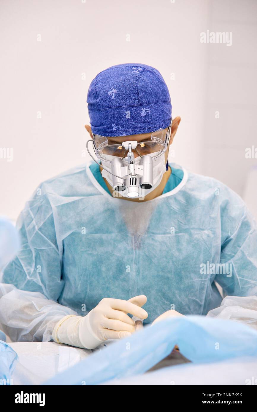 Doctor doing eye surgery of patient in operating room Stock Photo - Alamy