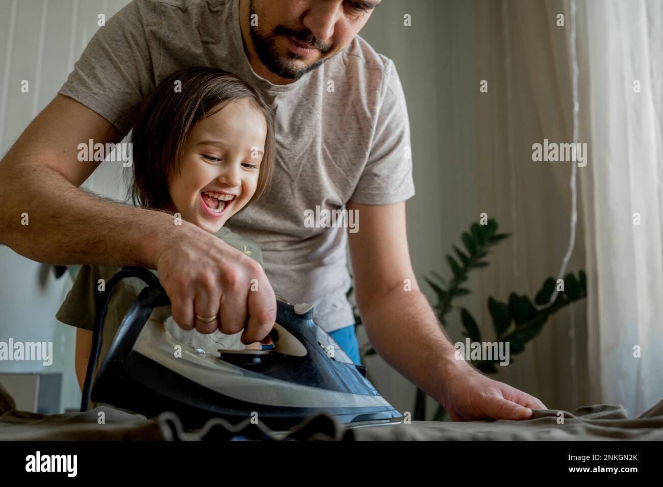 Husband ironing clothes hi-res stock photography and images - Alamy