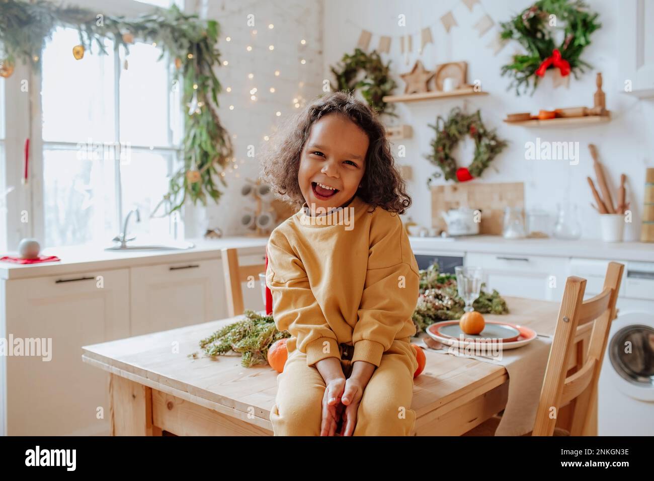 Happy children sitting table hi-res stock photography and images - Alamy
