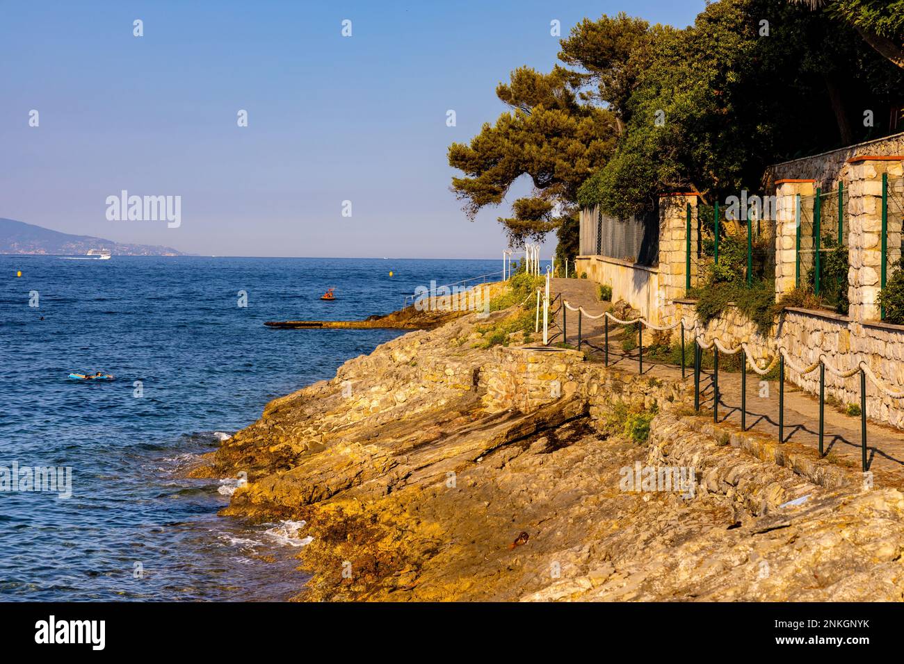 Rocky shoreline landscape of Saint-Jean-Cap-Ferrat resort town with ...
