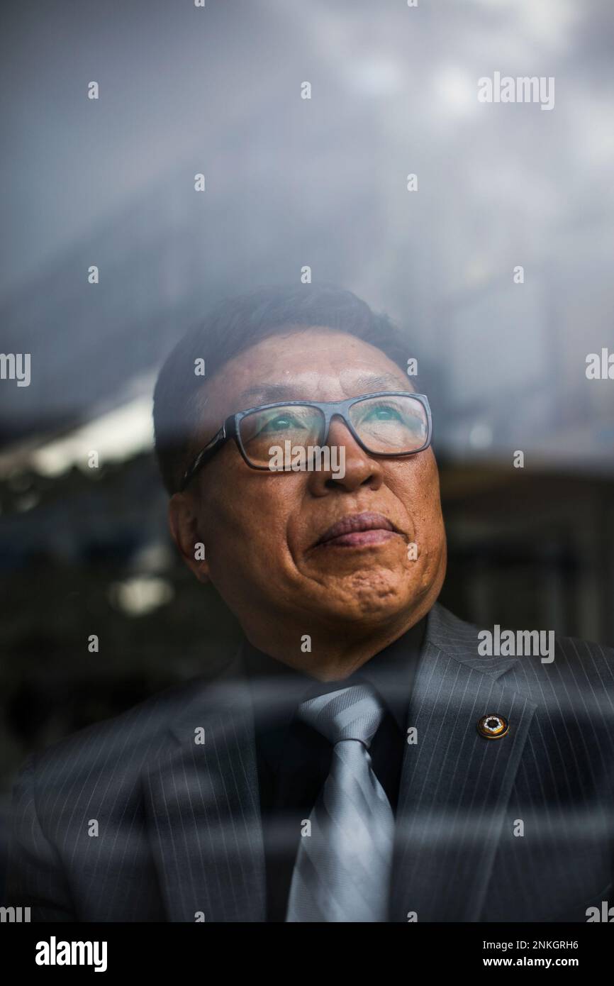 Paik Heang Ki looks through the window of his Taekwondo studio while ...
