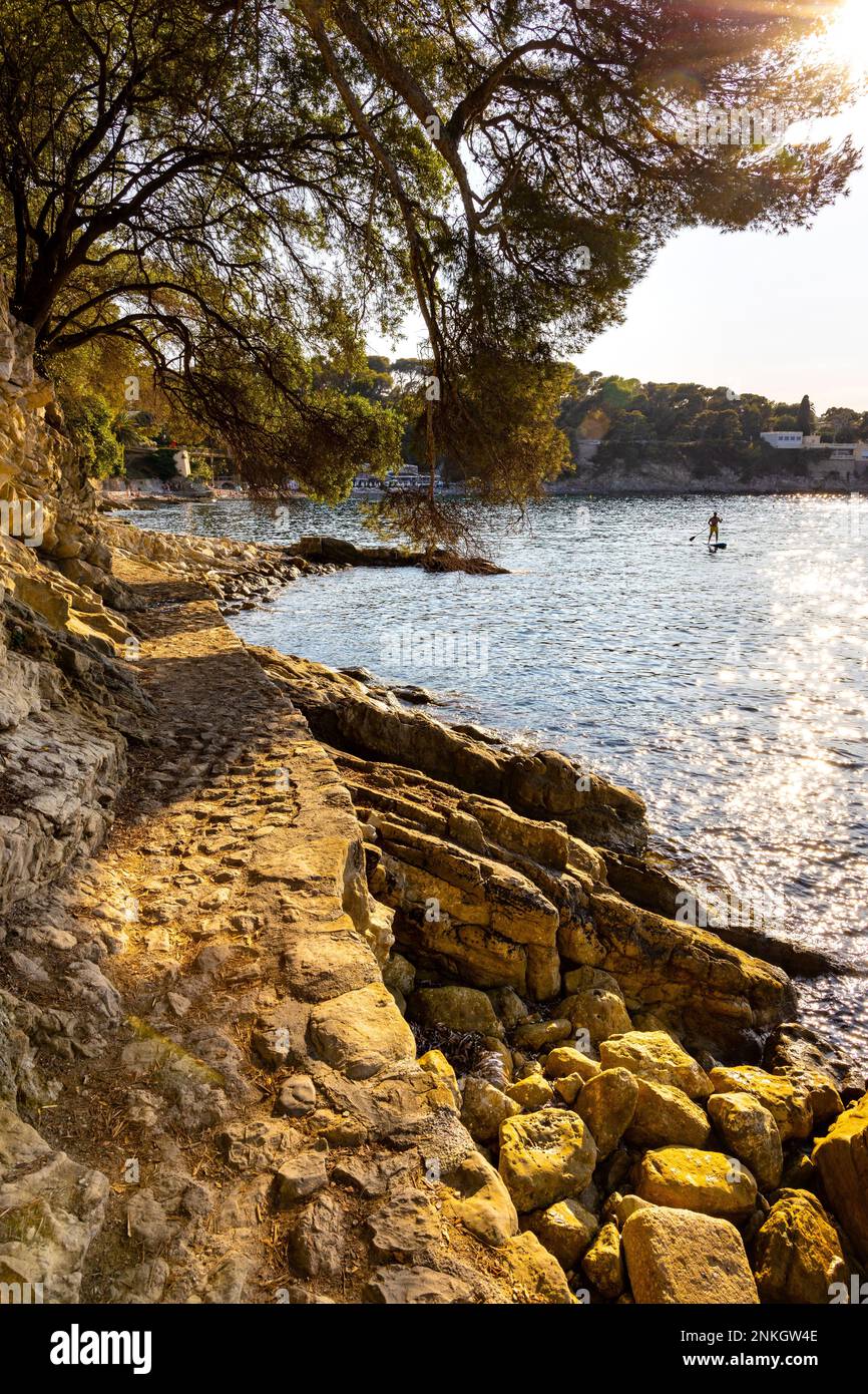 Rocky shoreline landscape of Saint-Jean-Cap-Ferrat resort town with ...