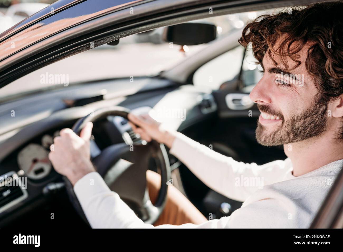 Man curly hair driving car hi-res stock photography and images - Alamy