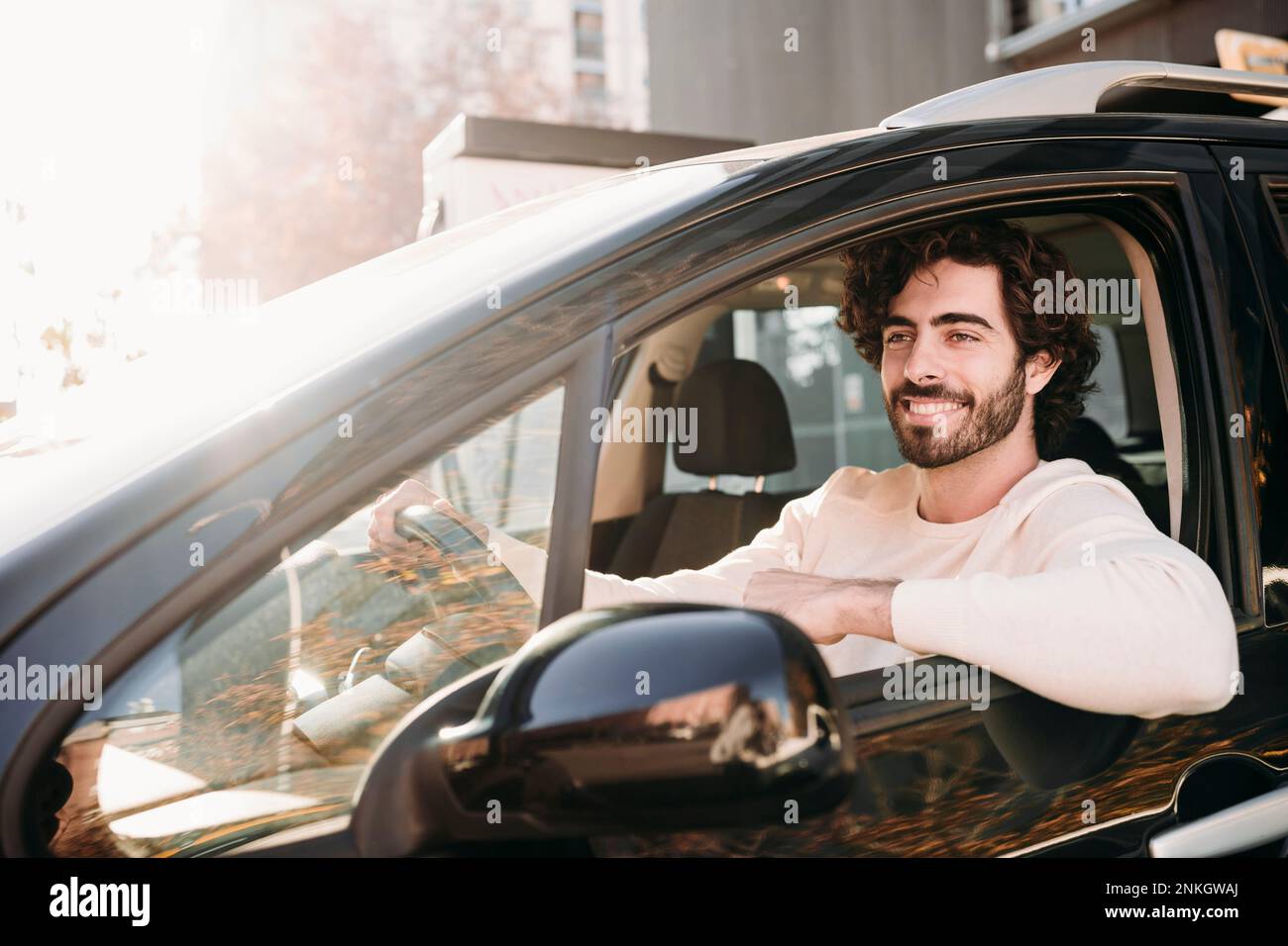 Happy man driving car hi-res stock photography and images - Alamy