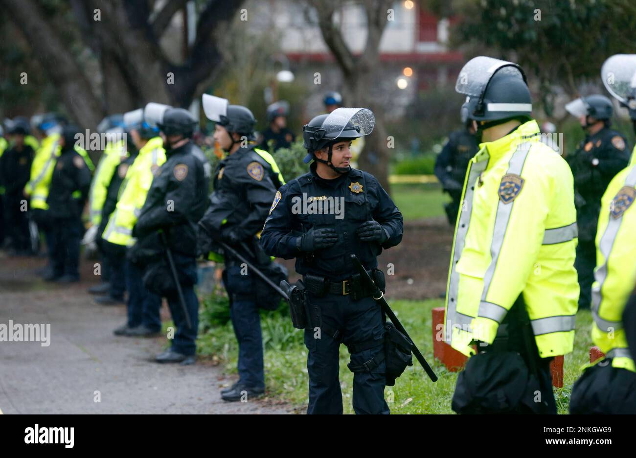 A line of police officers surround the eastern side of People's Park ...