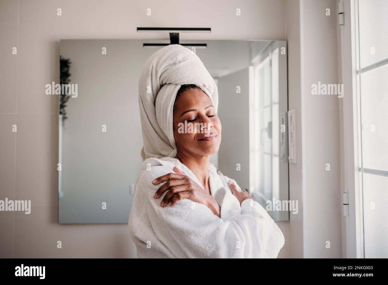 Woman bath hugging hi-res stock photography and images - Alamy