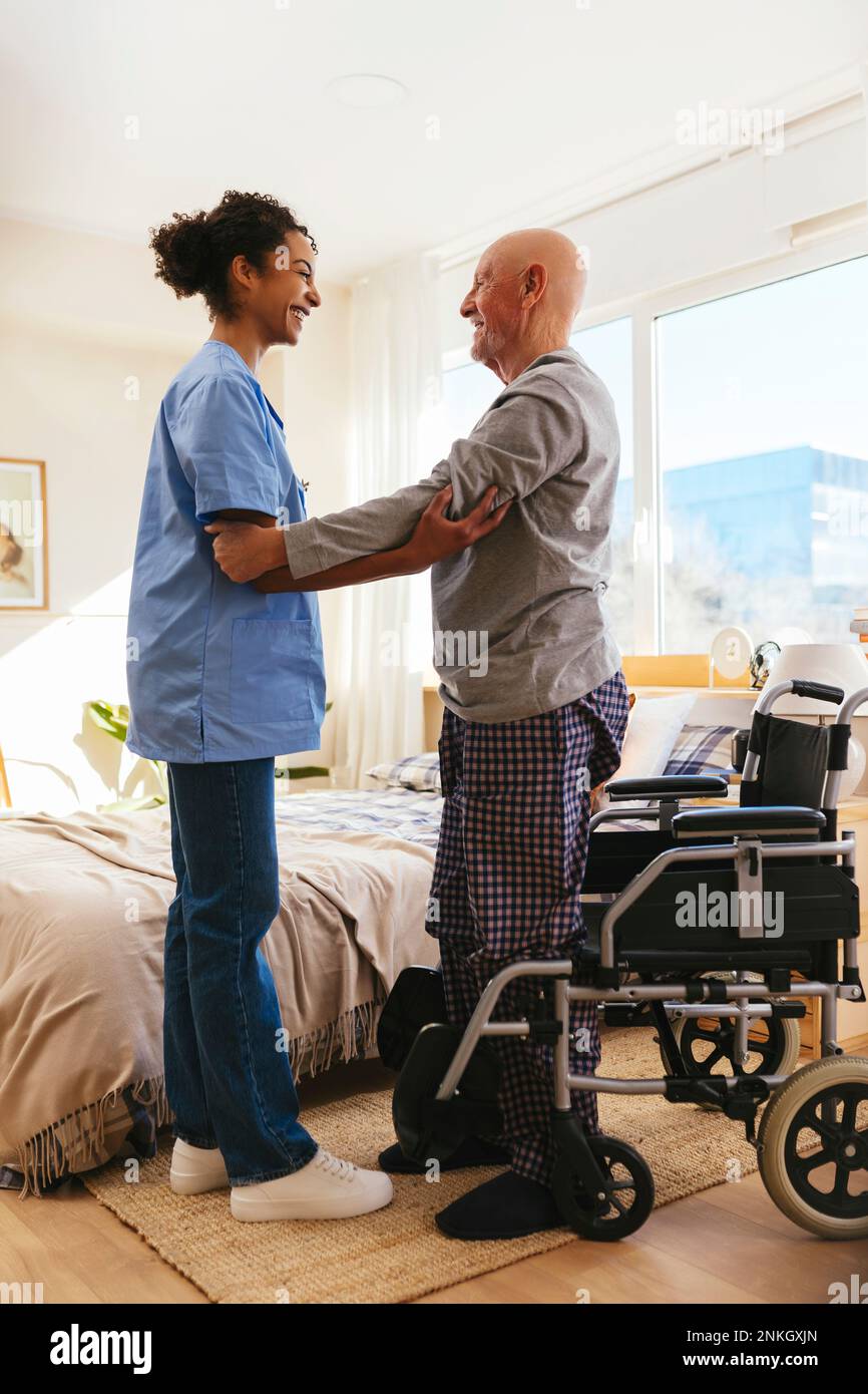 Female caregiver assisting senior hi-res stock photography and images ...