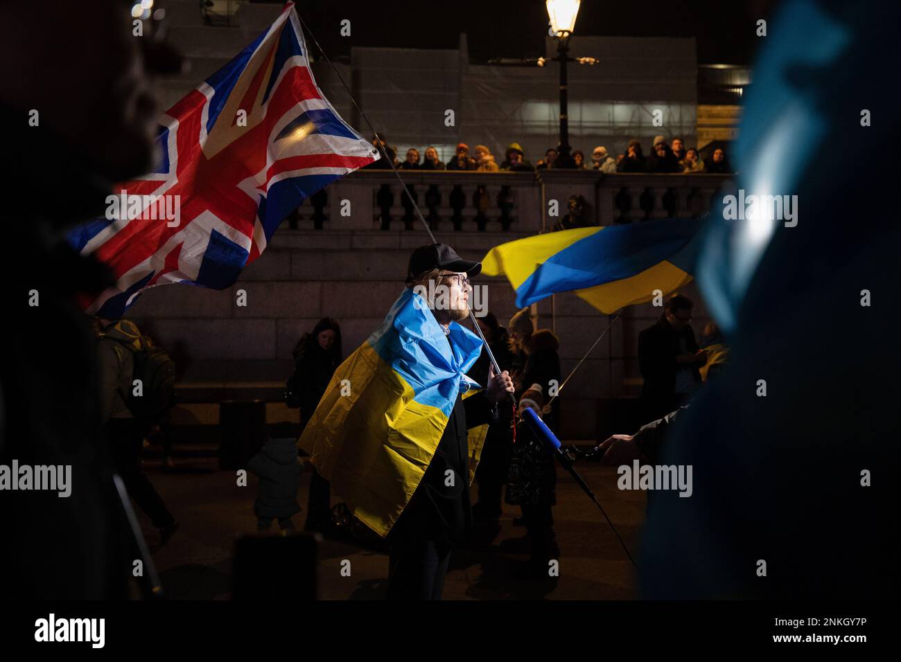London, UK. 23rd Feb, 2023. A supporter is seen holding a Union Jack ...