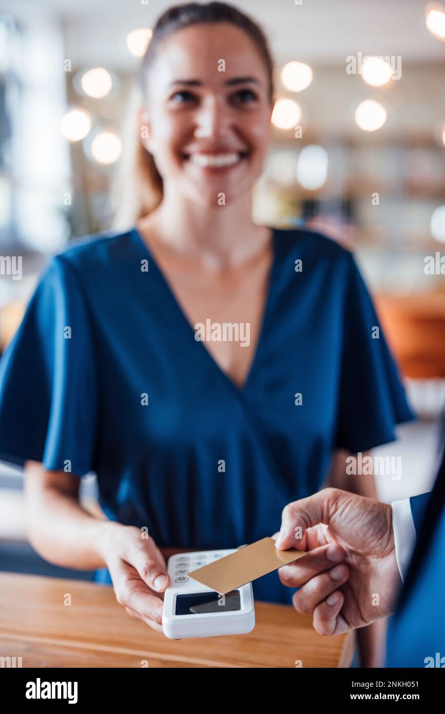 Business people using contactless payment method at office Stock Photo ...