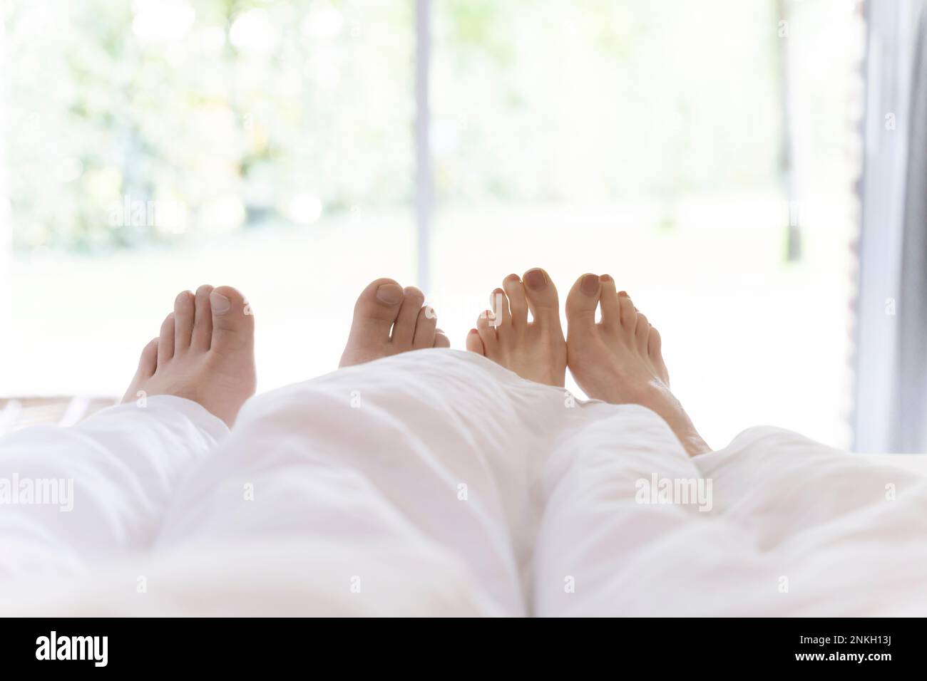 Feet under blanket hi-res stock photography and images - Alamy