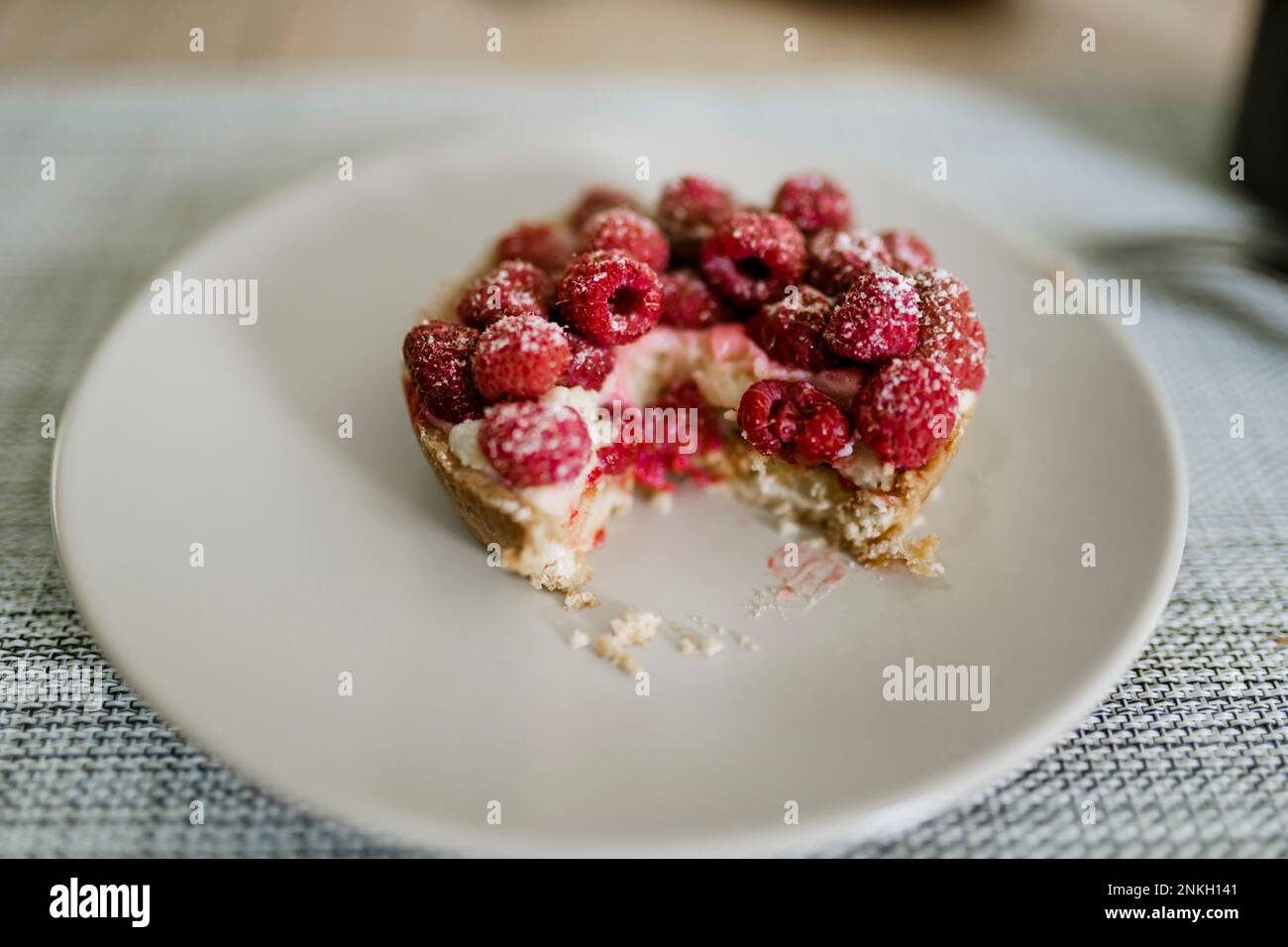 Delicious raspberry cake on plate on table Stock Photo - Alamy
