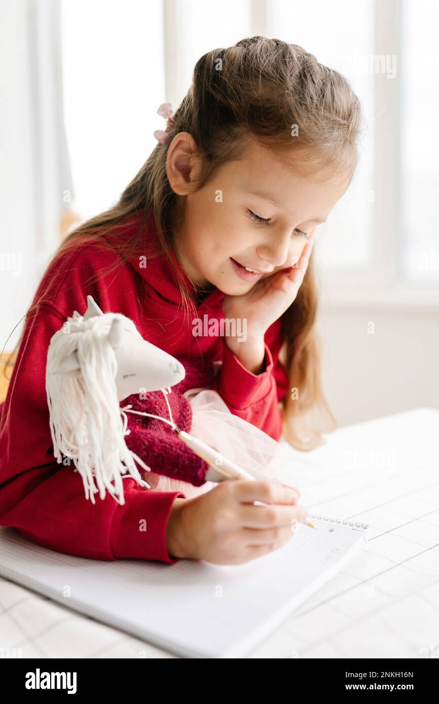 Cute girl doing home hi-res stock photography and images - Alamy