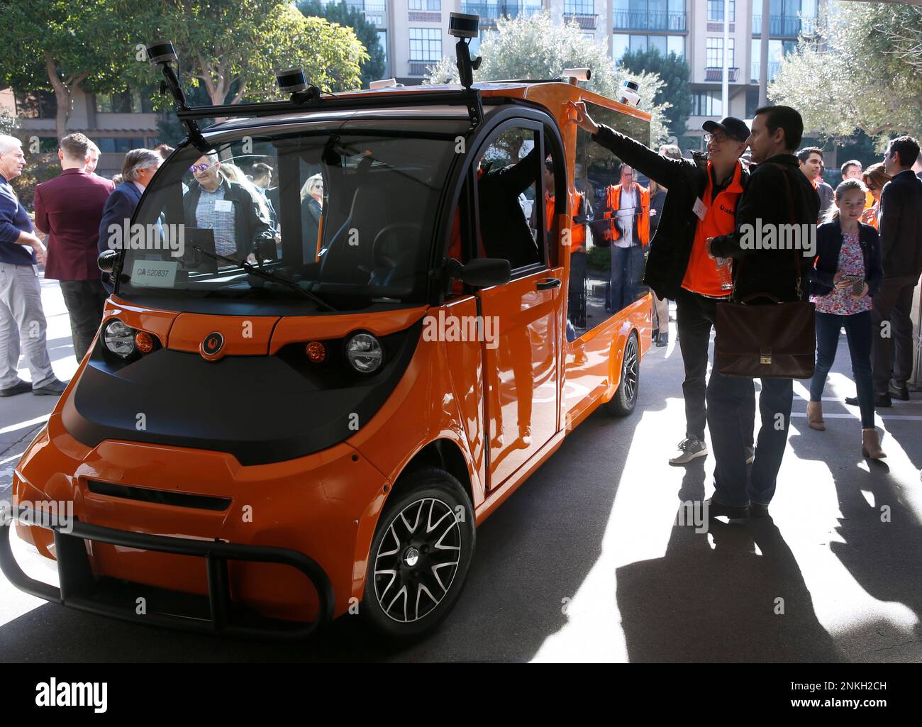 Yunong Jiang (left) and Nick Degnan look at an autonomous grocery ...