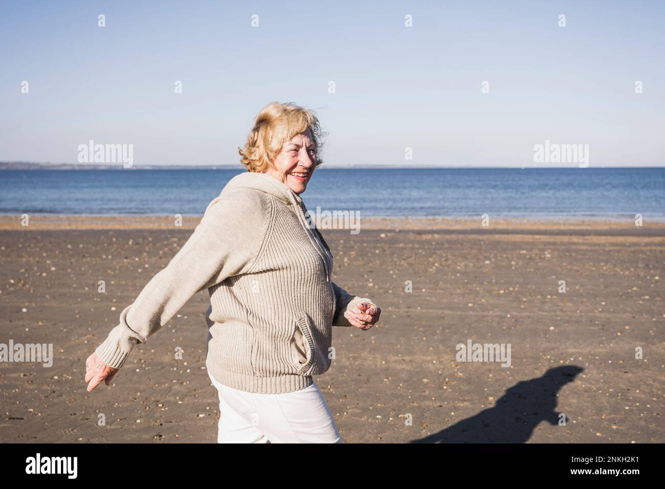 Elderly woman walking side view hi-res stock photography and images - Alamy