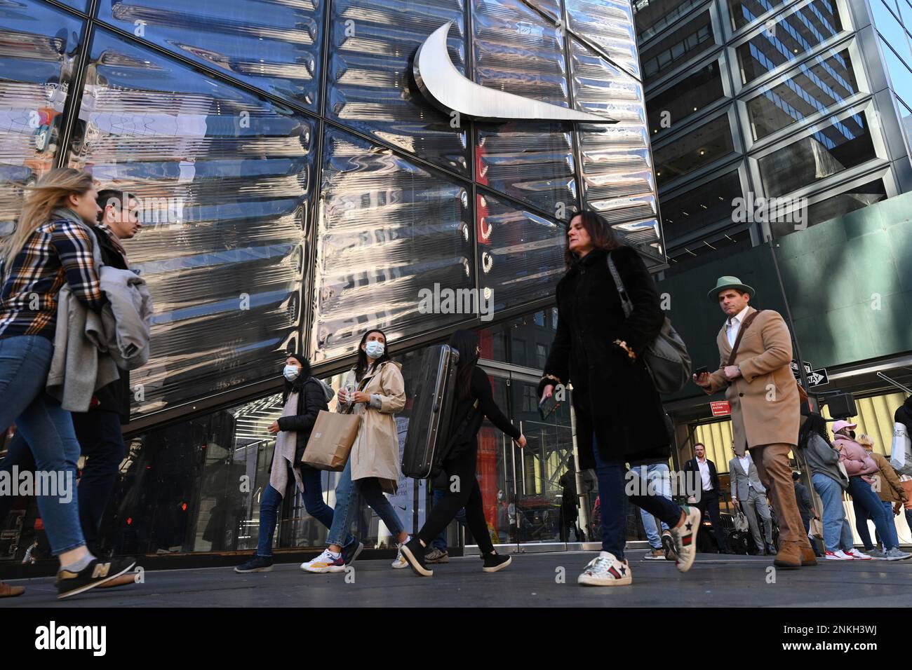 Photo by: NDZ/STAR MAX/IPx 2022 3/21/22 People walk past the Nike Store ...