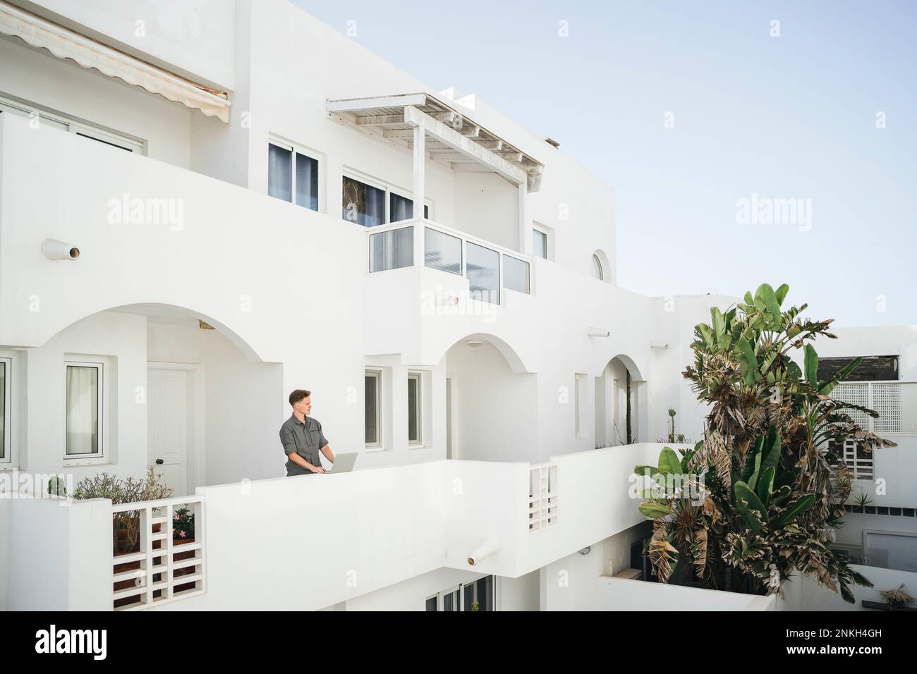 Man standing in balcony hi-res stock photography and images - Alamy