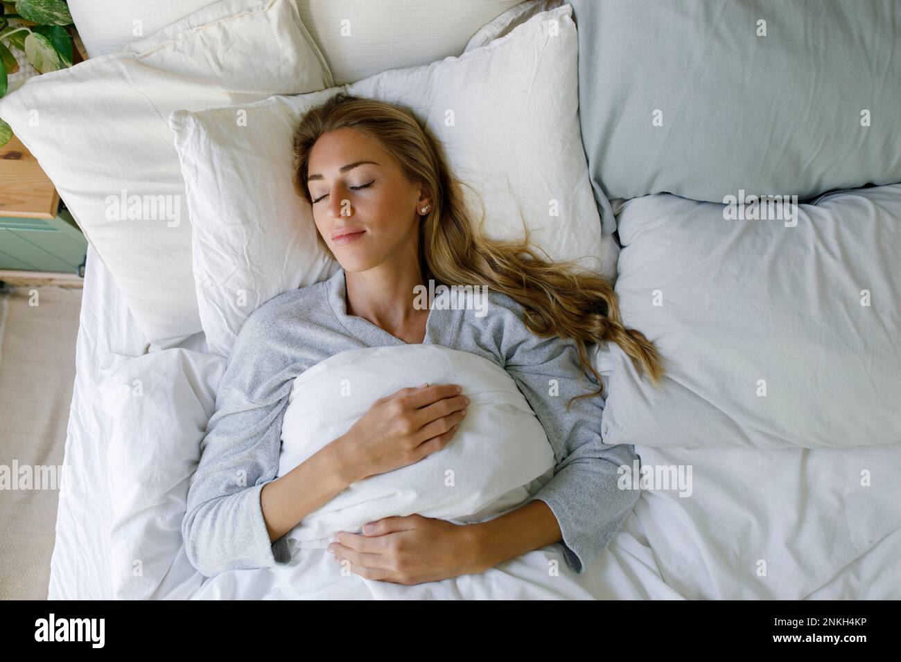 Woman sleeping in bedroom at home Stock Photo - Alamy