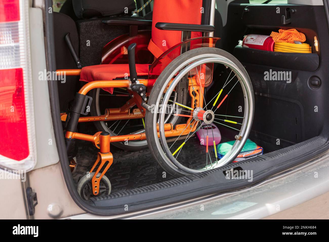 Wheelchair in open car trunk Stock Photo - Alamy