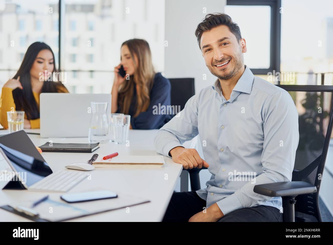 Happy asian man sitting workplace hi-res stock photography and images - Alamy