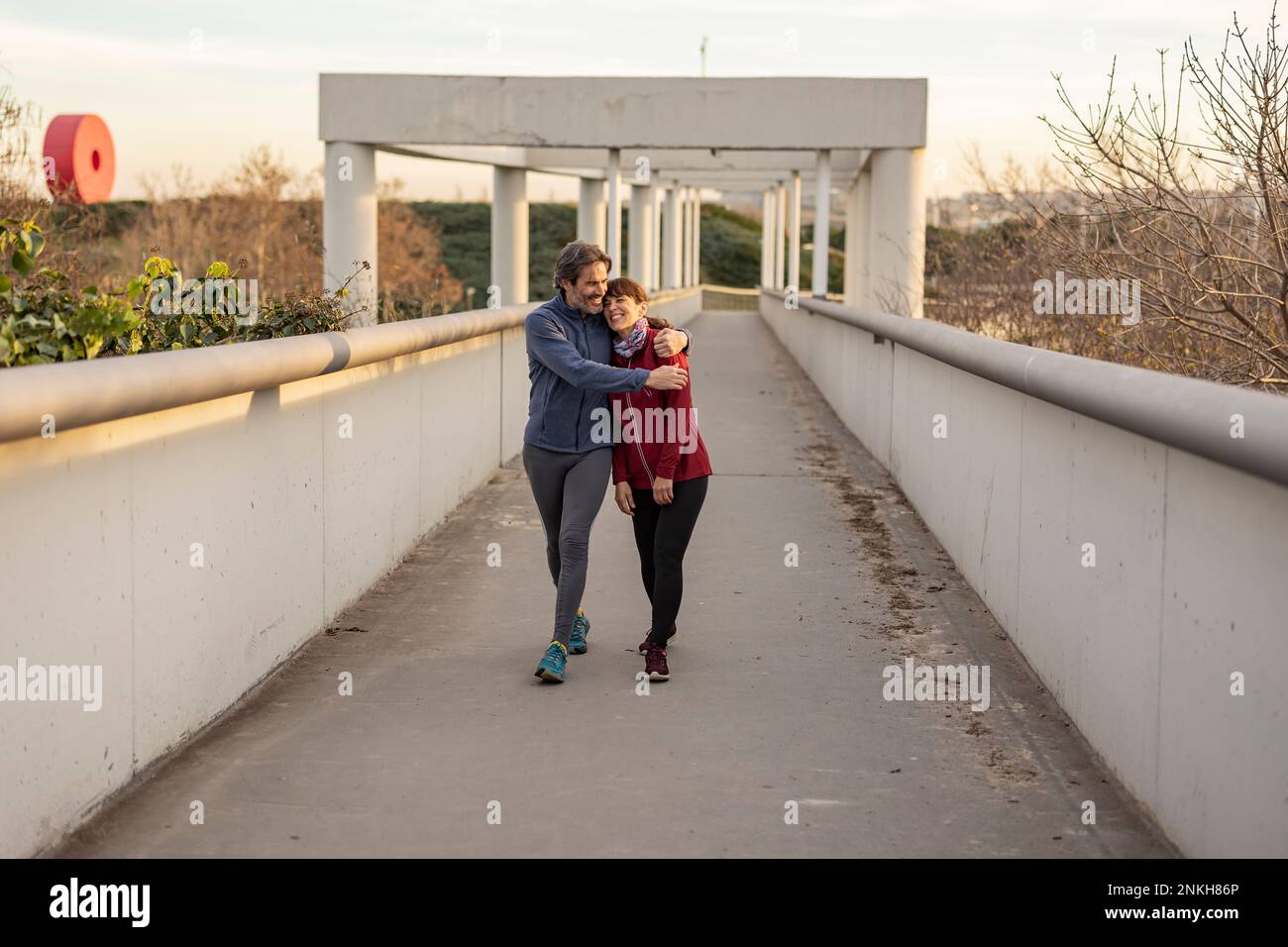 Couple hugging on bridge hi-res stock photography and images - Alamy