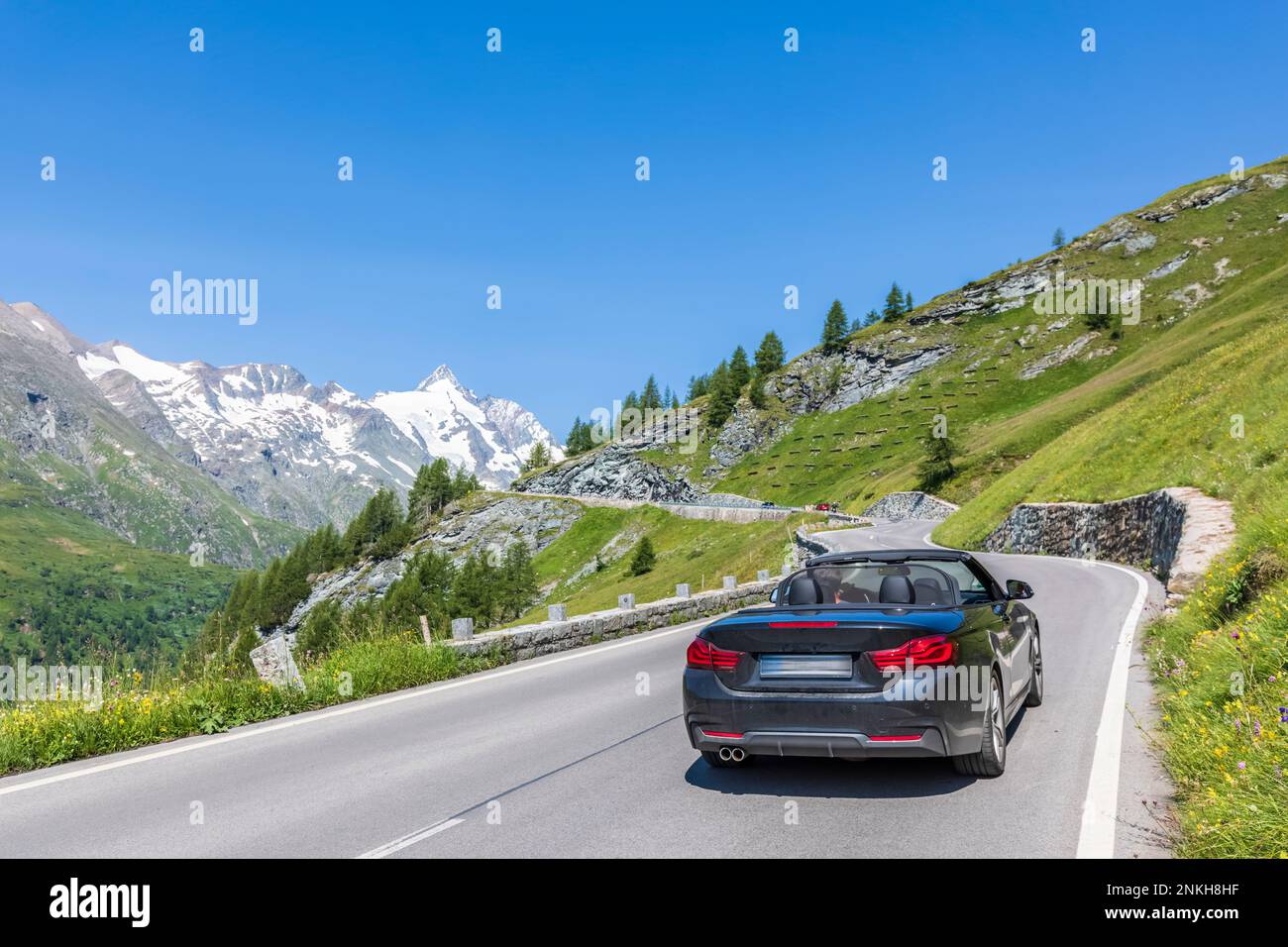 Austria, Salzburg, Sports car driving along Grossglockner High Alpine ...