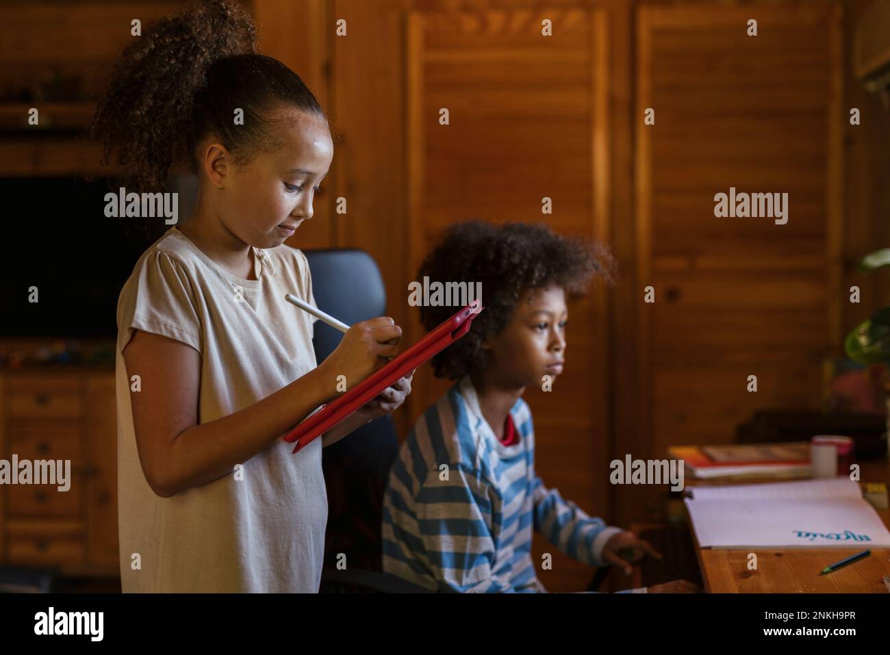 Brother and sister writing hi-res stock photography and images - Alamy
