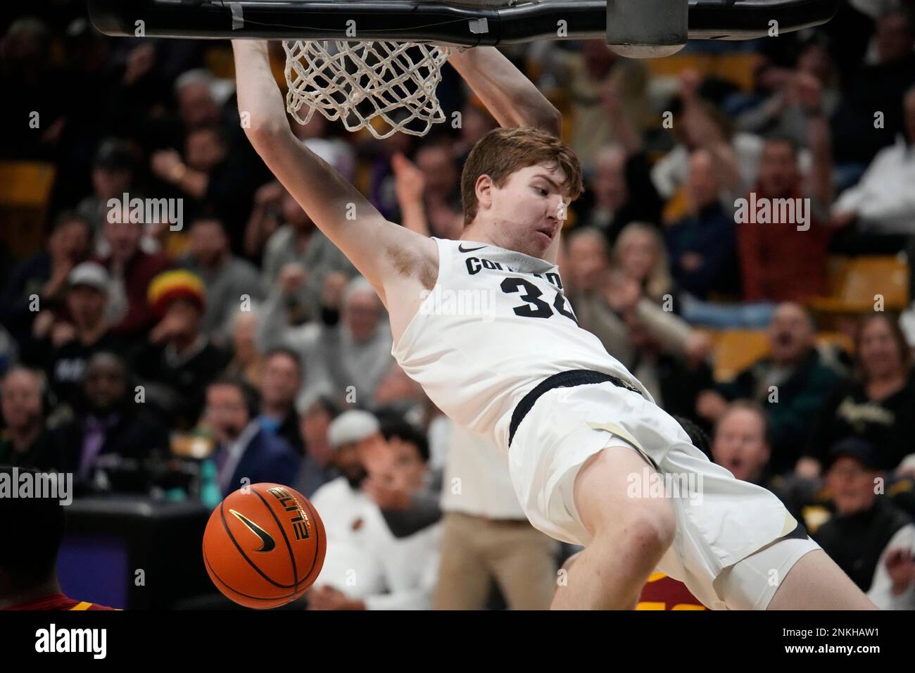 Colorado center Lawson Lovering hangs on the rim after dunking the ball ...