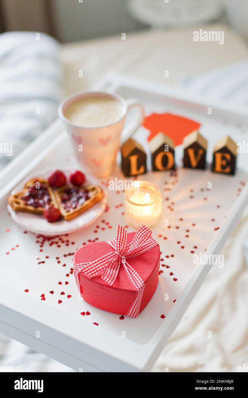 Heart shaped gift box with breakfast on tray Stock Photo - Alamy