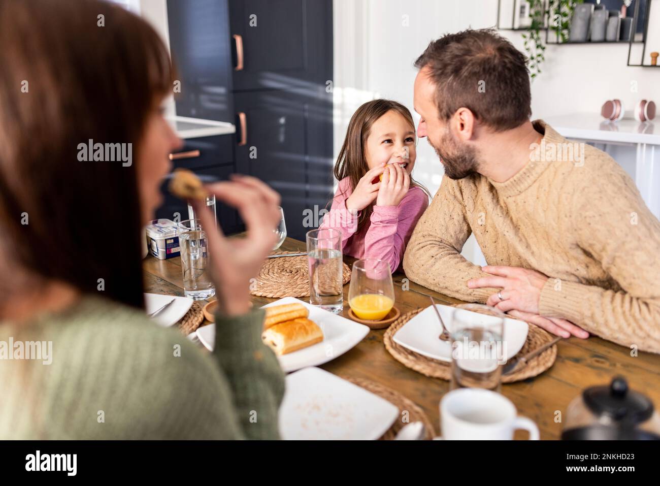 Children having fun at breakfast table hi-res stock photography and ...