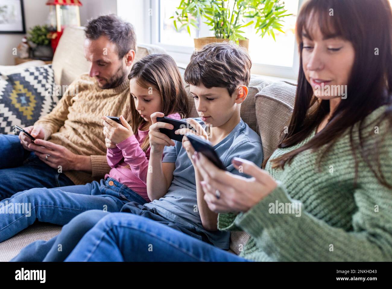 Mobile communication family life hi-res stock photography and images ...