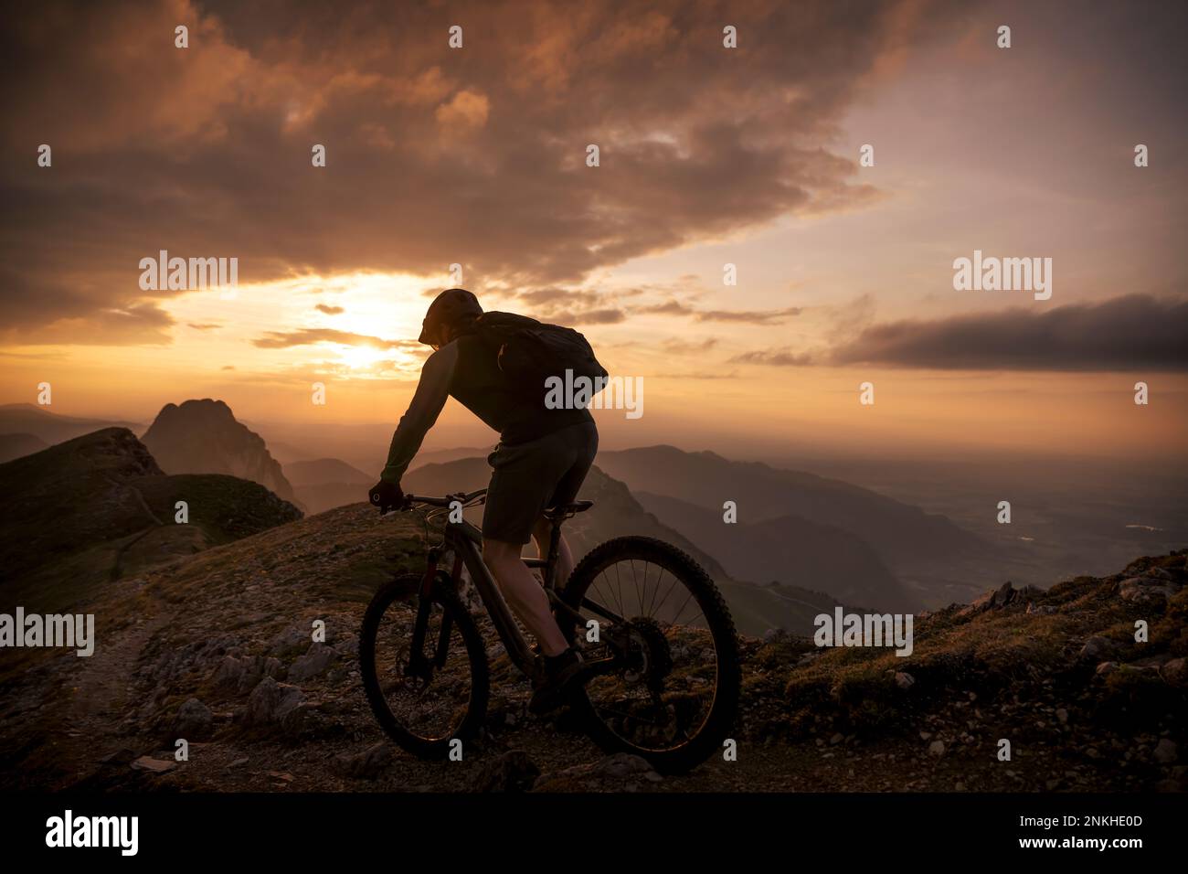 Mountain biker riding on slope at mountain Stock Photo - Alamy