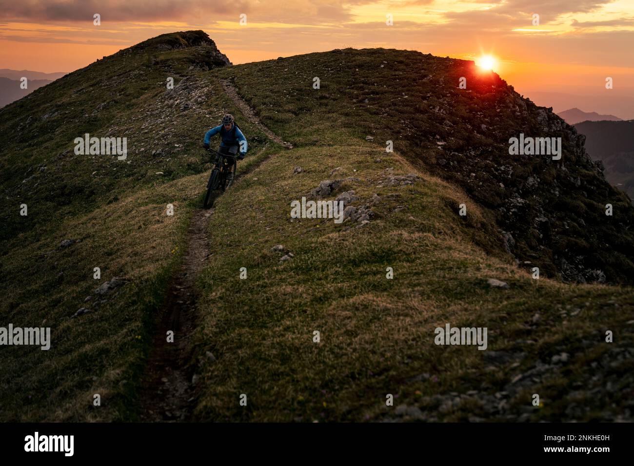 Man riding bike away hi-res stock photography and images - Alamy