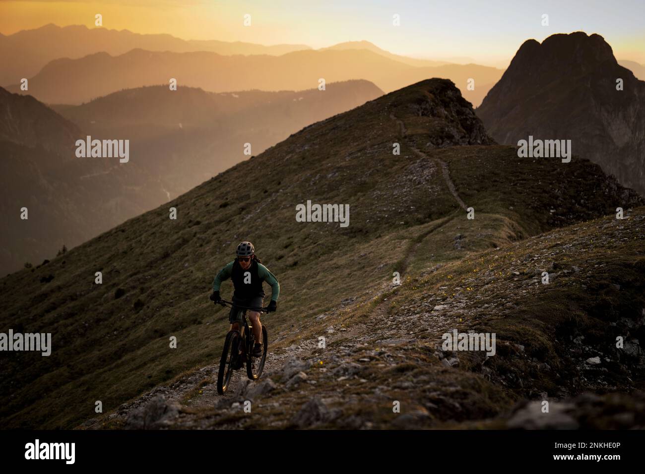 Biker with bike at sunset hi-res stock photography and images - Alamy
