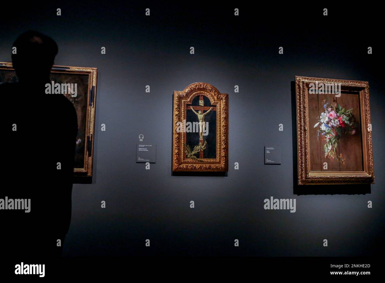 Visitors contemplate the works that are part of the exhibition ...