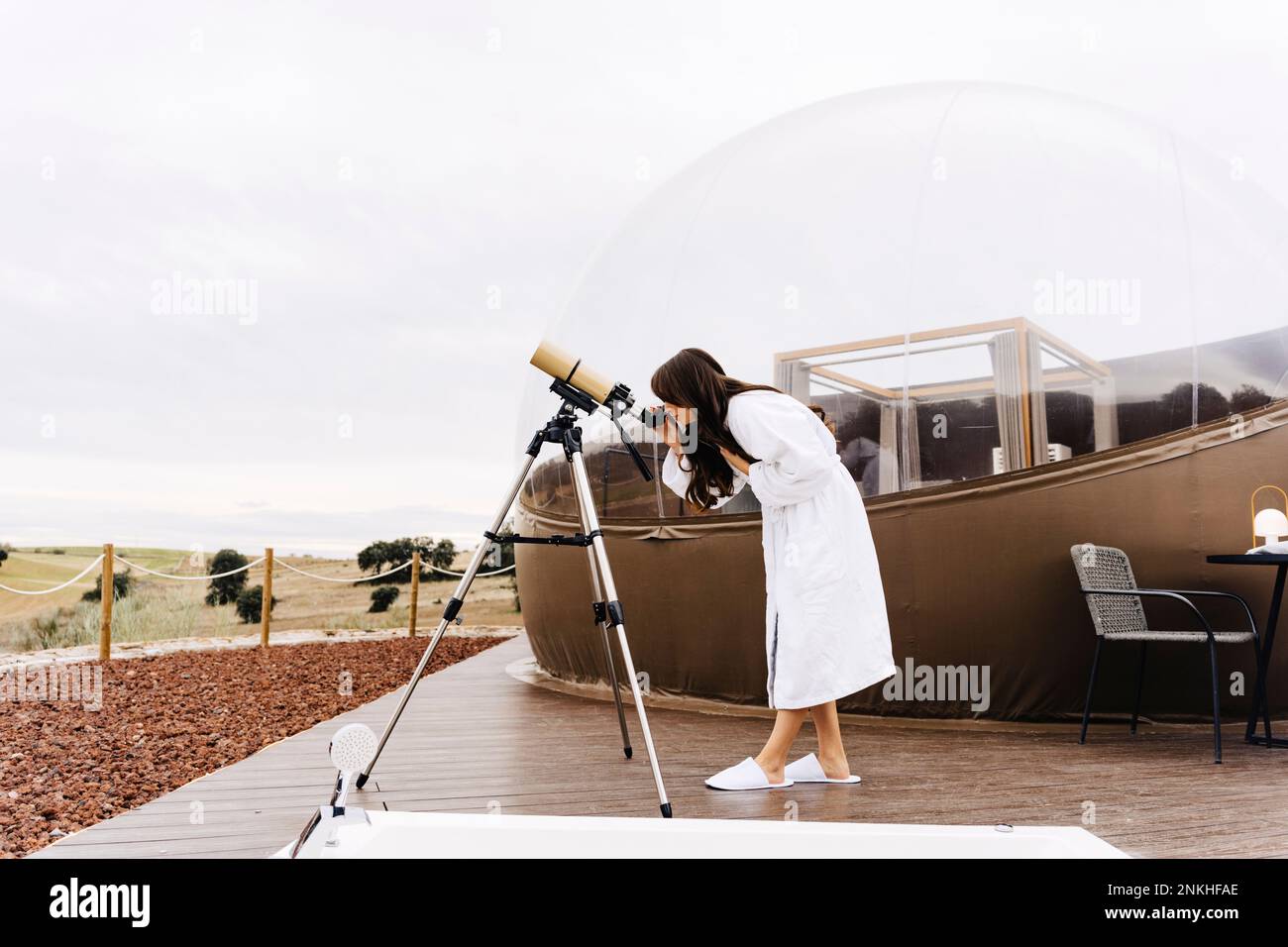 Woman telescope hi-res stock photography and images - Alamy