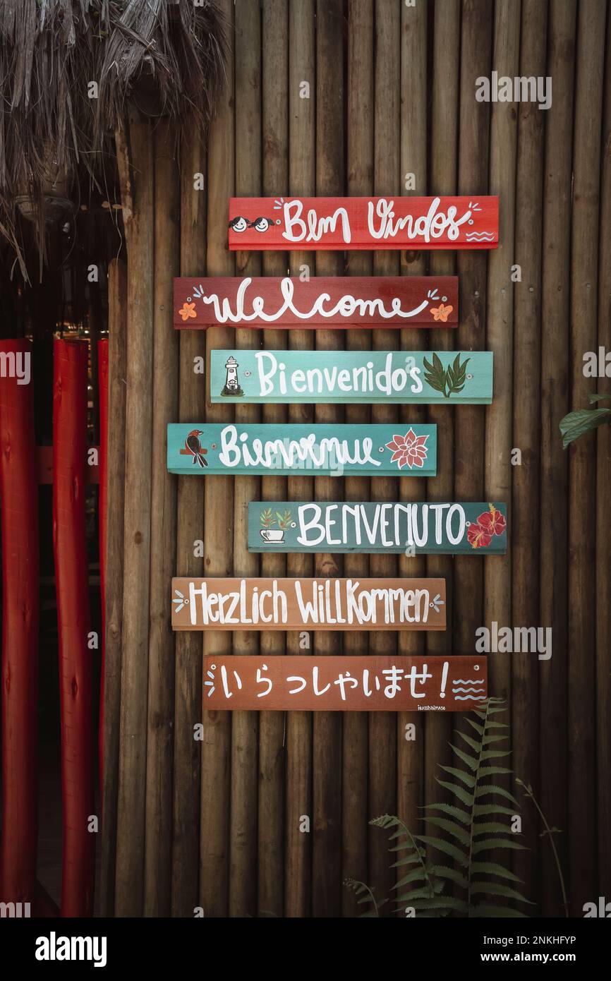Wooden signs written "welcome" in several languages create a warm and ...