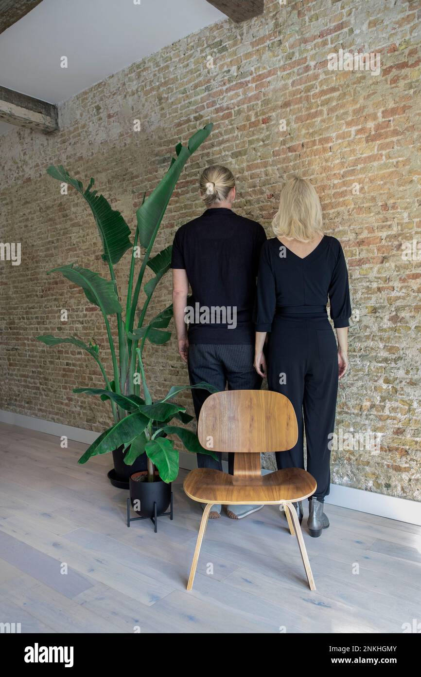 Man standing facing wall hi-res stock photography and images - Alamy