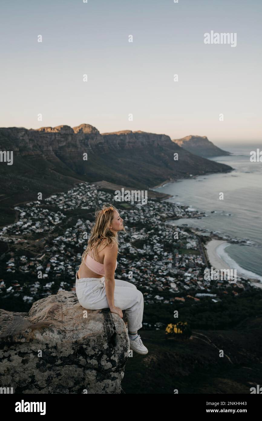 Sunrise with person on rock hi-res stock photography and images - Alamy