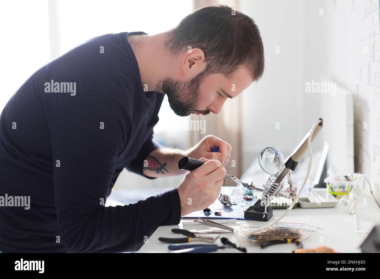 Focused engineer working with hand tools at workshop Stock Photo - Alamy