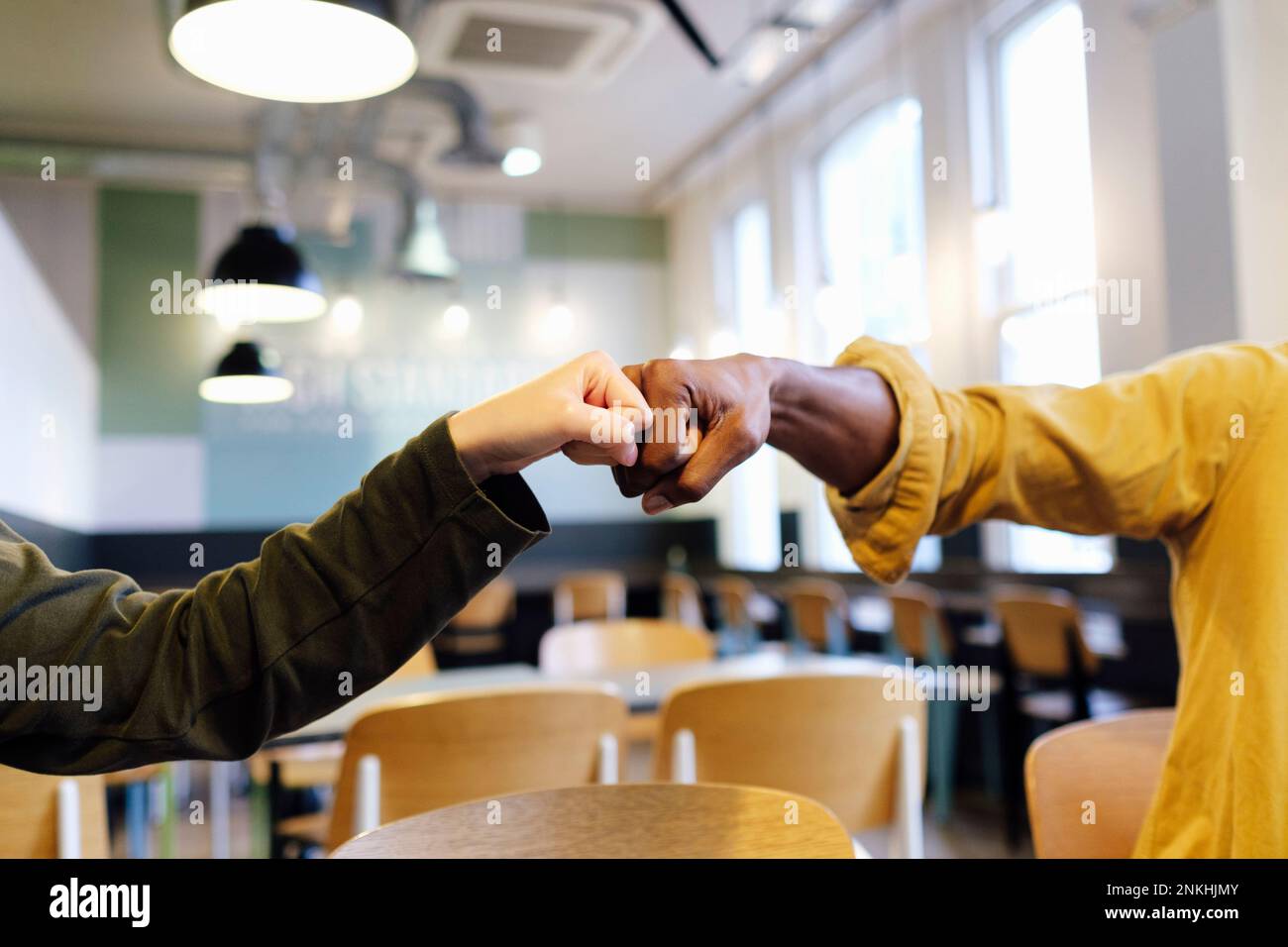 Fist bump hands hi-res stock photography and images - Alamy