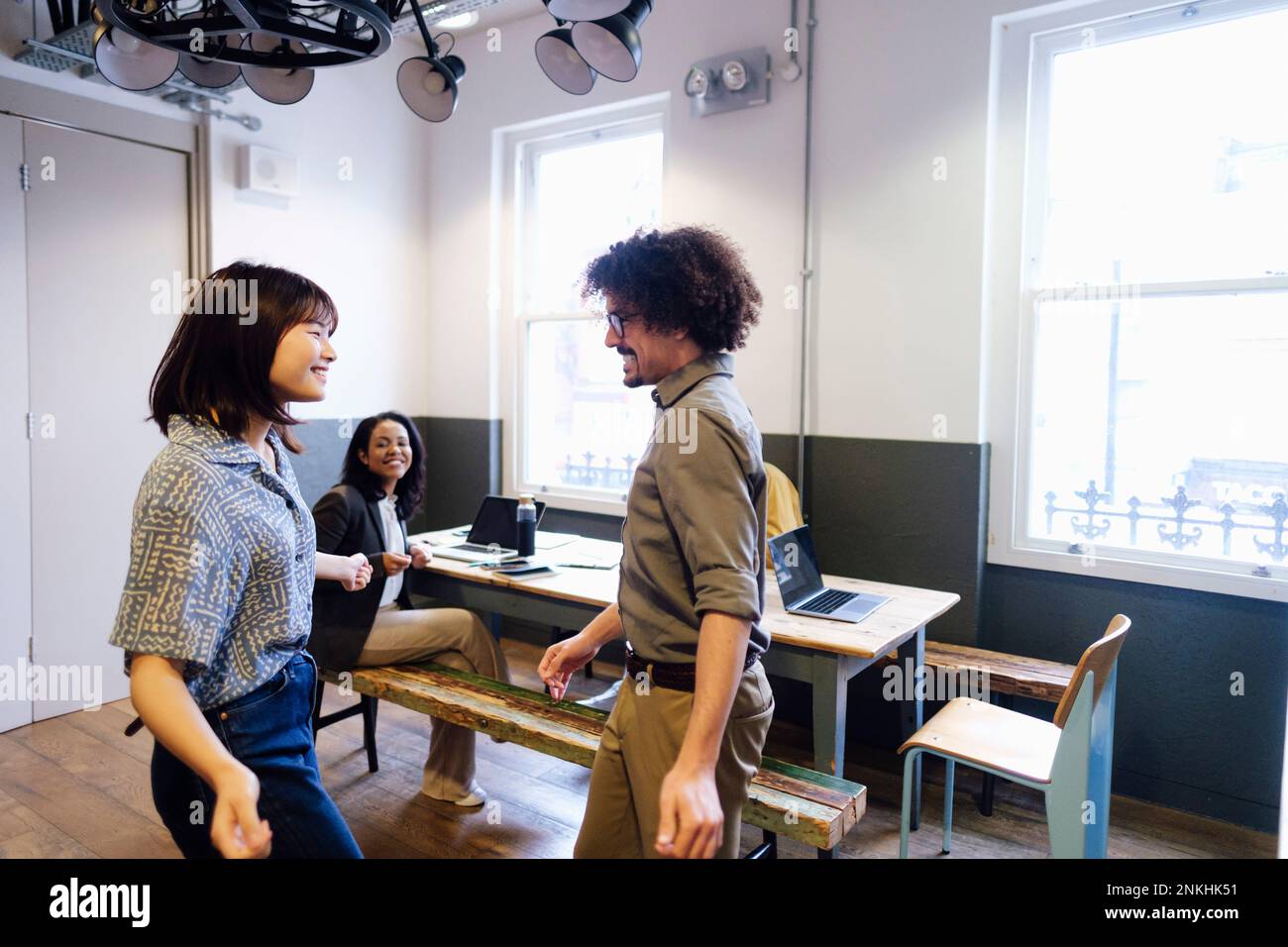 Happy business colleagues dancing together at office Stock Photo - Alamy