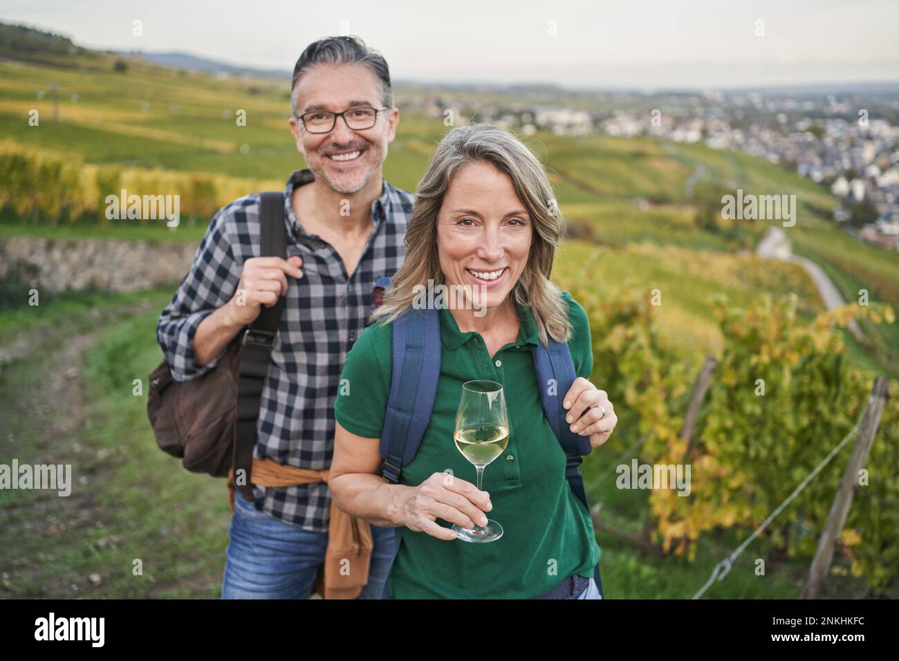 Happy mature couple enjoying wine tasting in vineyard Stock Photo - Alamy