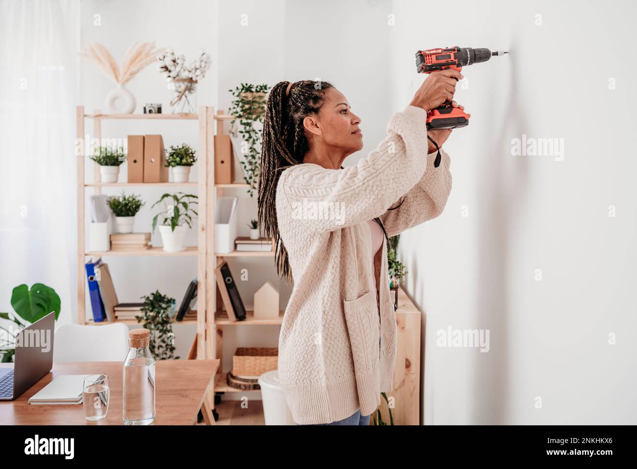 Female wall drill hi-res stock photography and images - Alamy