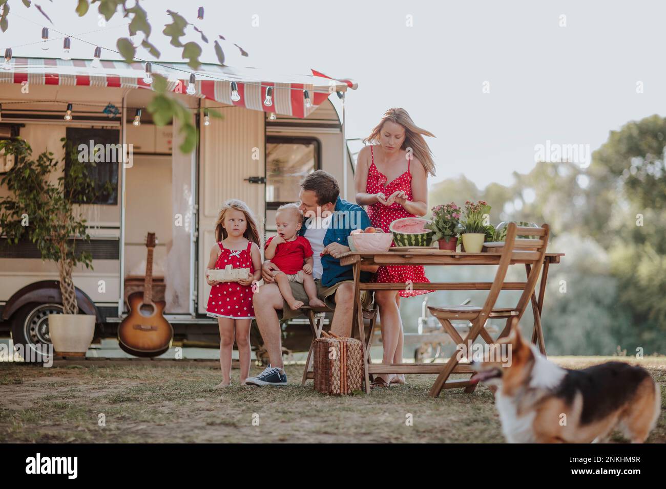 Parents and children prepating picnic camper van Stock Photo - Alamy