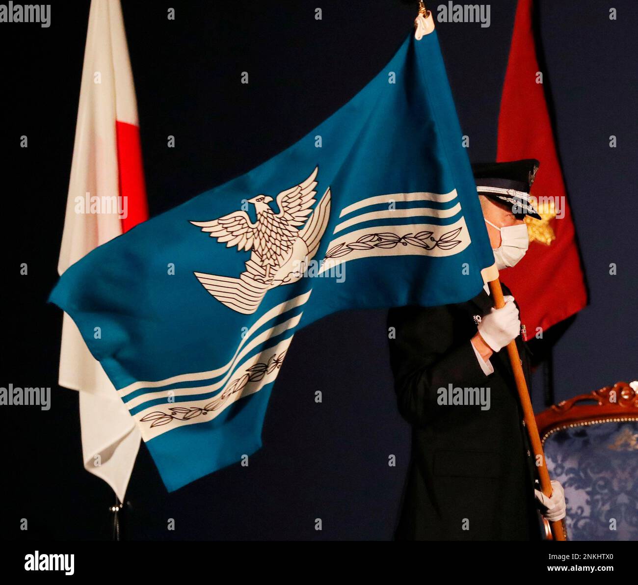 Kazuki Tamaki, colonel of Japan Air Self Defense Forces holds the group ...