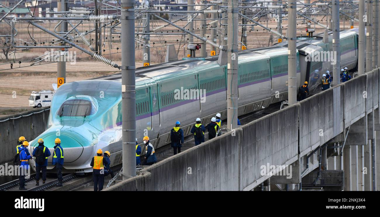 A photo shows the shinkansen (bullet train) which was derailed due to ...