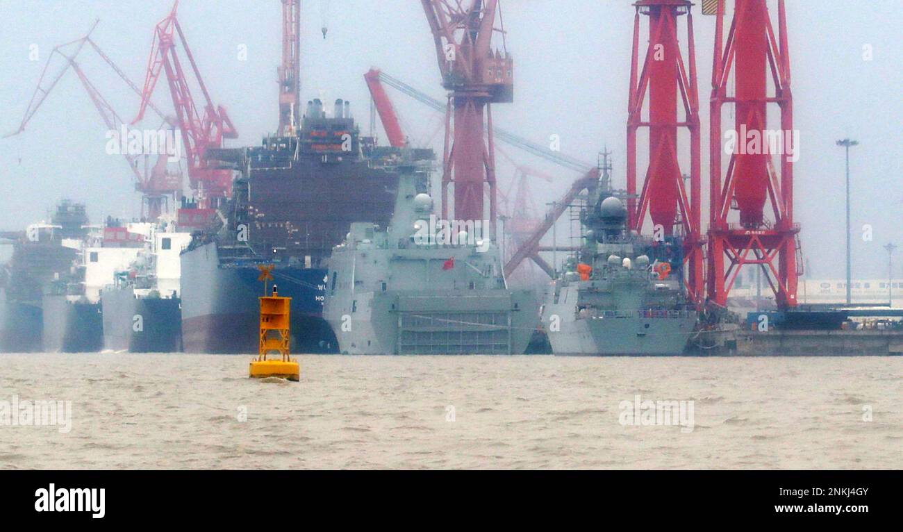 Chinese naval vessels are pictured around a shipyard in Shanghai on ...